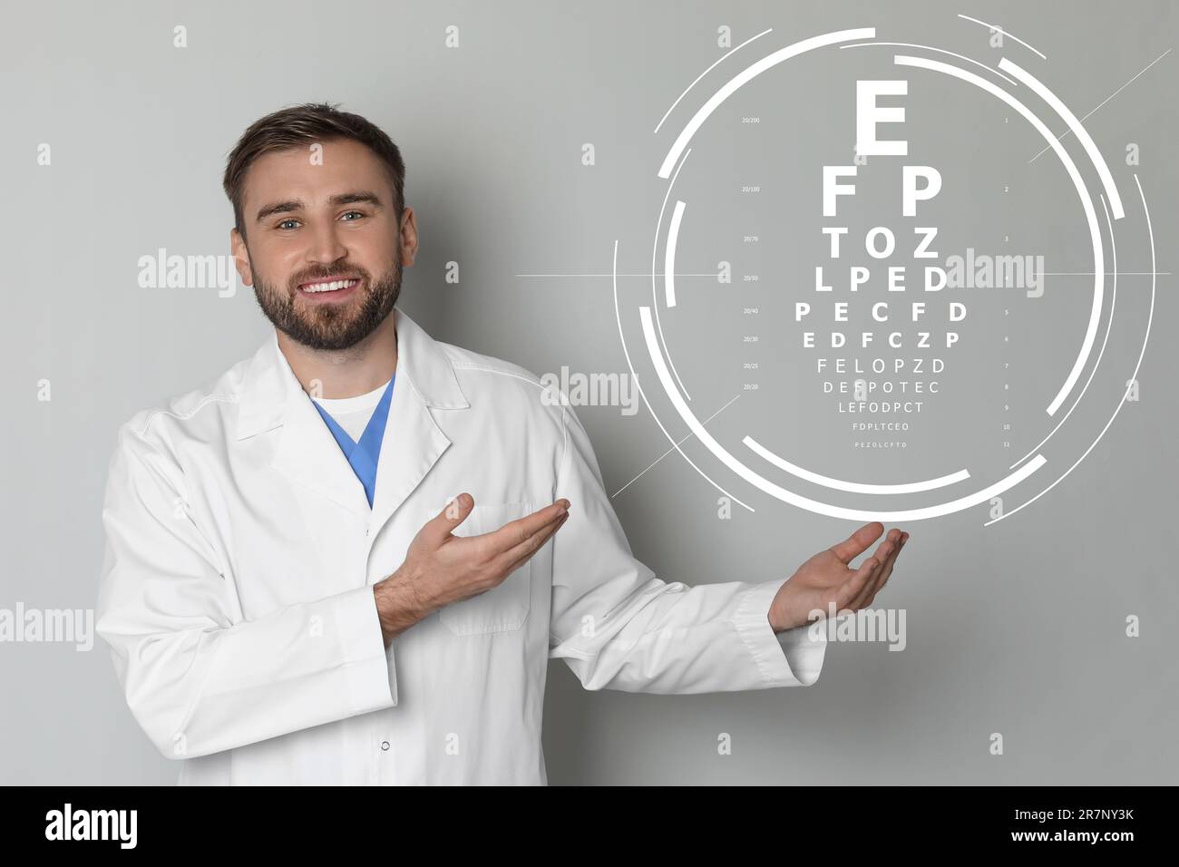 Vision test. Ophthalmologist or optometrist pointing at eye chart on ...