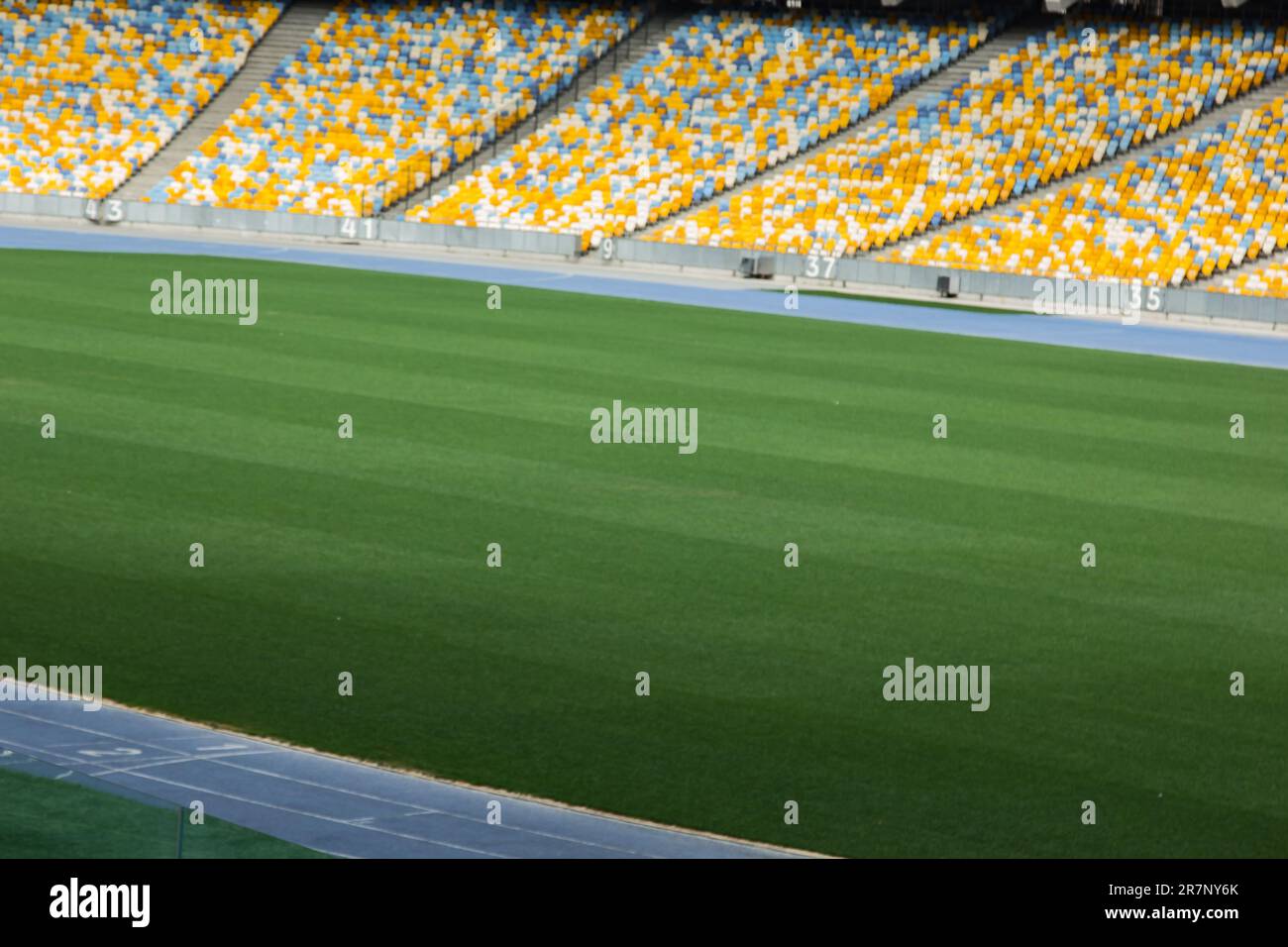 soccer stadium inside view. football field, empty stands, a crowd of ...