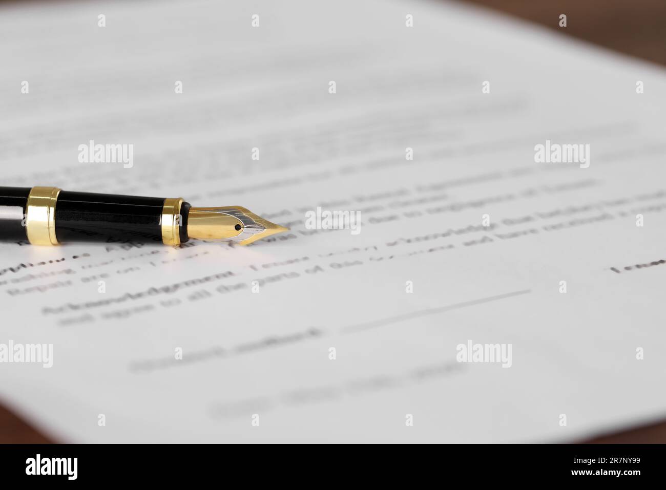 Fountain pen on document, closeup and space for text. Notary contract ...