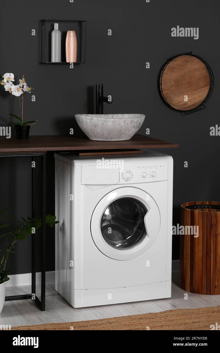 Stylish laundry room with washing machine. Interior design Stock Photo ...