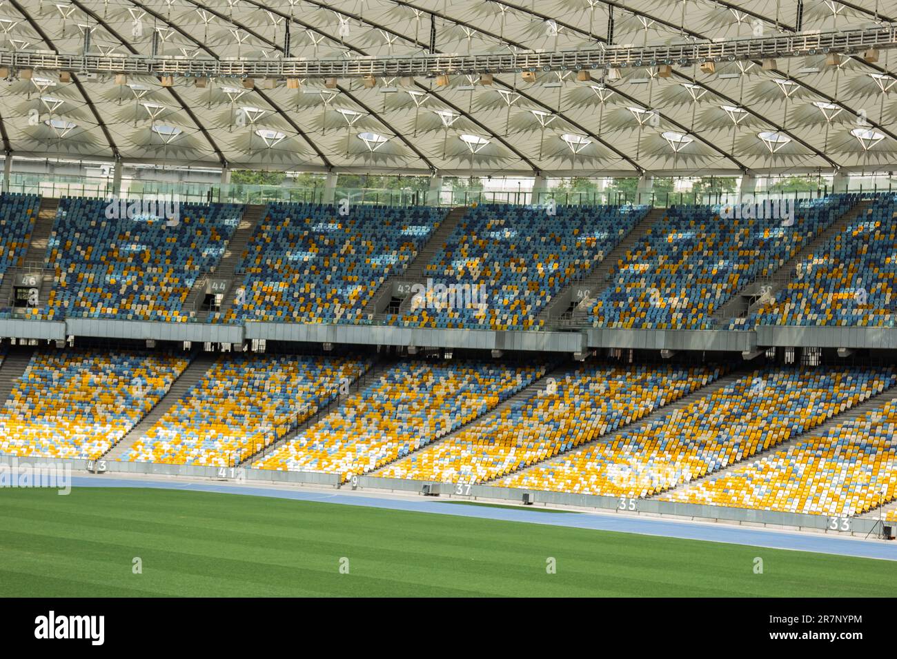 soccer stadium inside view. football field, empty stands, a crowd of ...
