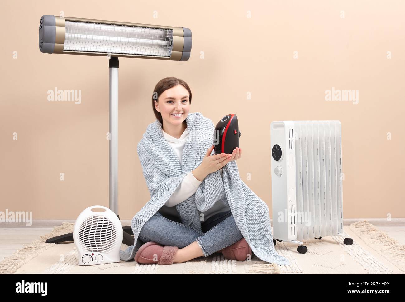 Adult near heaters hi-res stock photography and images - Alamy
