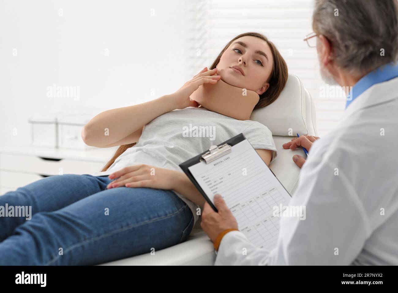 Doctor filling patient's medical card in clinic Stock Photo - Alamy