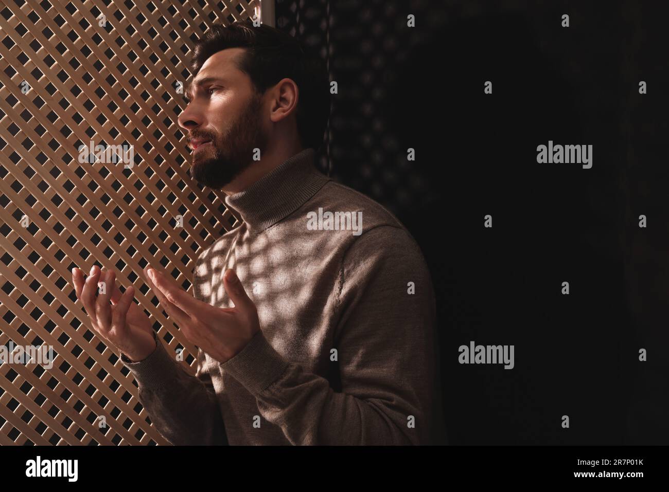 Man talking to priest during confession in booth, space for text Stock ...