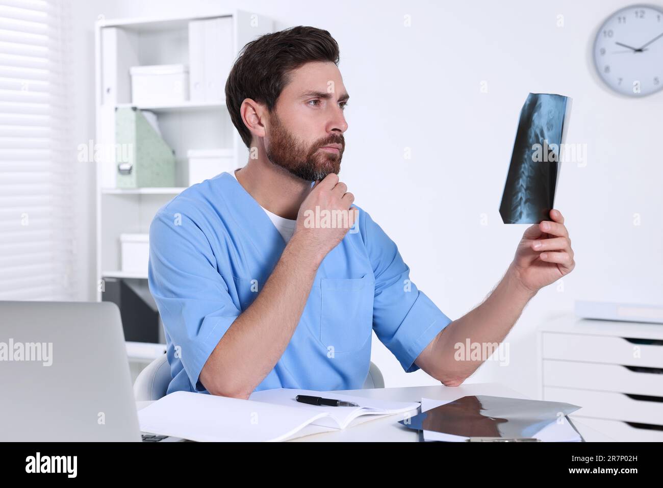 Doctor examining neck MRI scan in hospital Stock Photo - Alamy