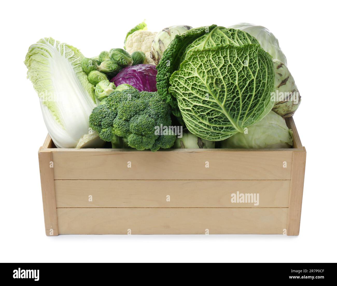 Wooden crate with different types of fresh cabbage on white background ...