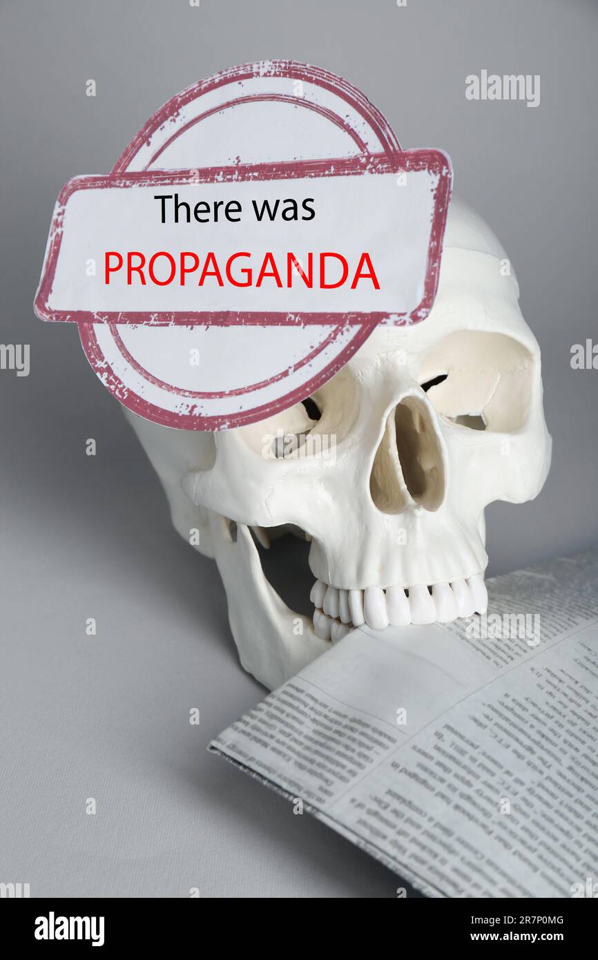 Information warfare concept, media propaganda influence. Human skull ...