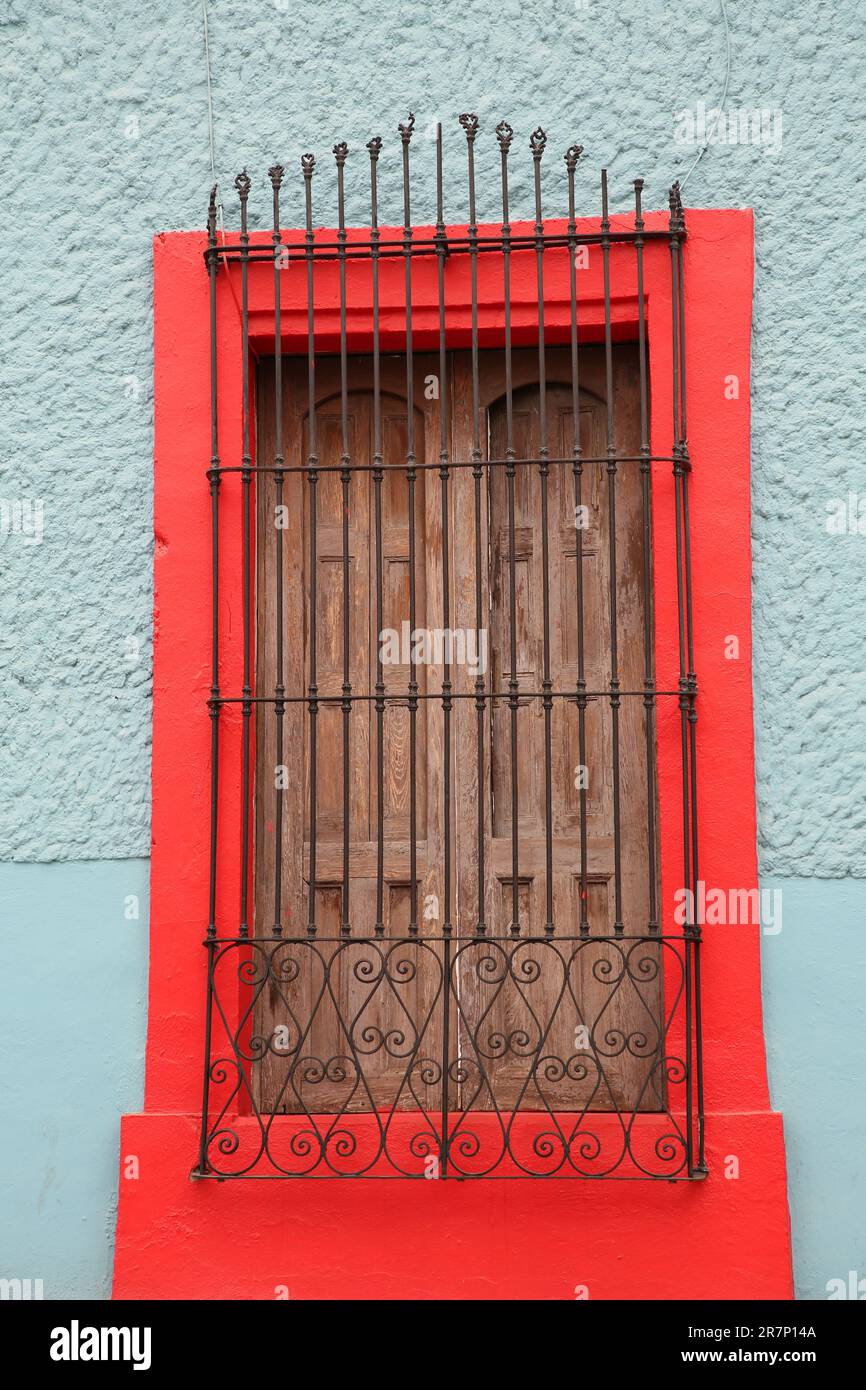 Light blue building with beautiful window and steel grilles Stock Photo ...