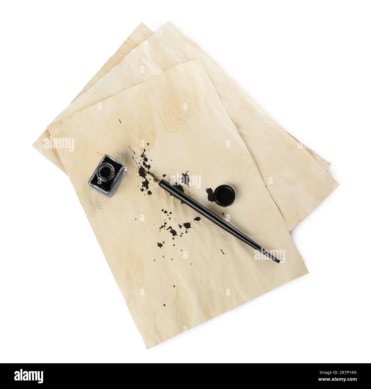 Parchment with stains of ink, fountain pen and inkwell on white ...