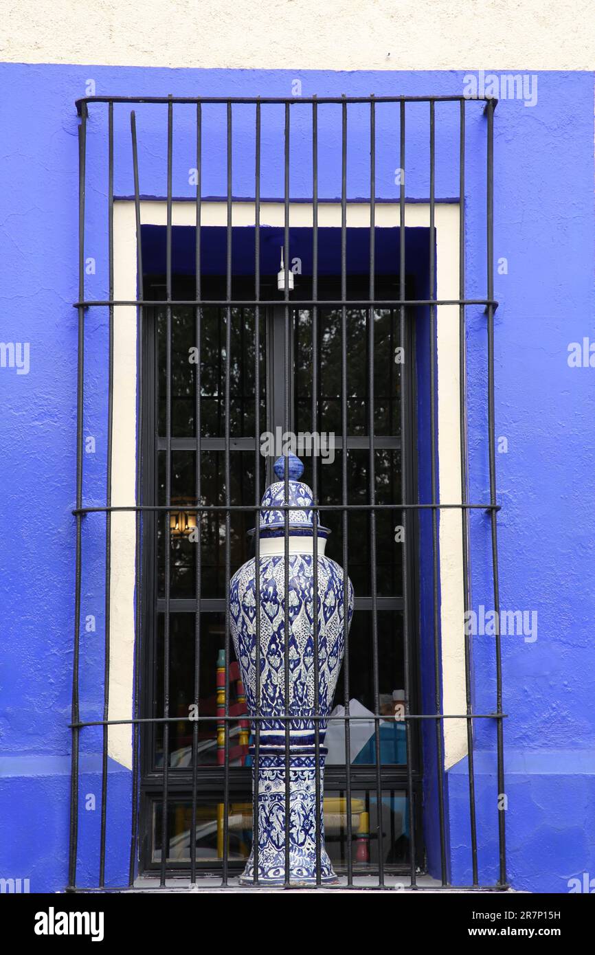 Blue building with beautiful window and steel grilles Stock Photo - Alamy
