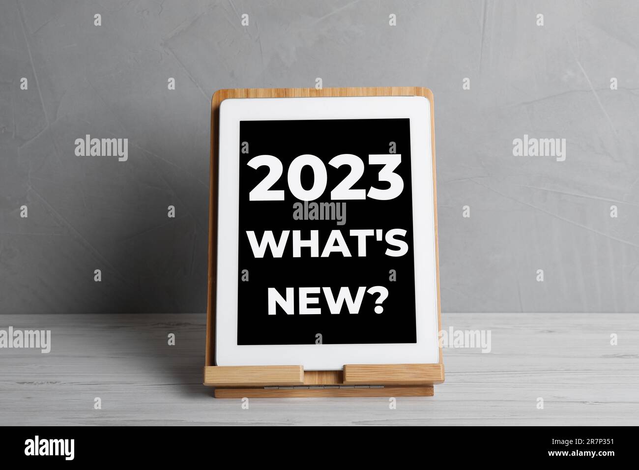 Future trends. 2023 What's New? text on tablet display. Modern gadget ...