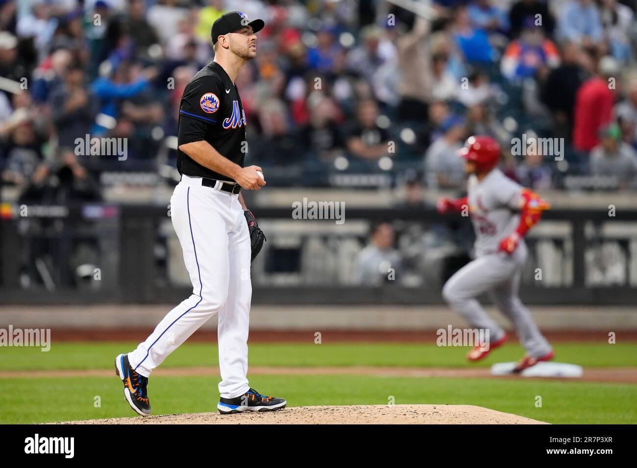 New York Mets starting pitcher Tylor Megill waits as St. Louis ...