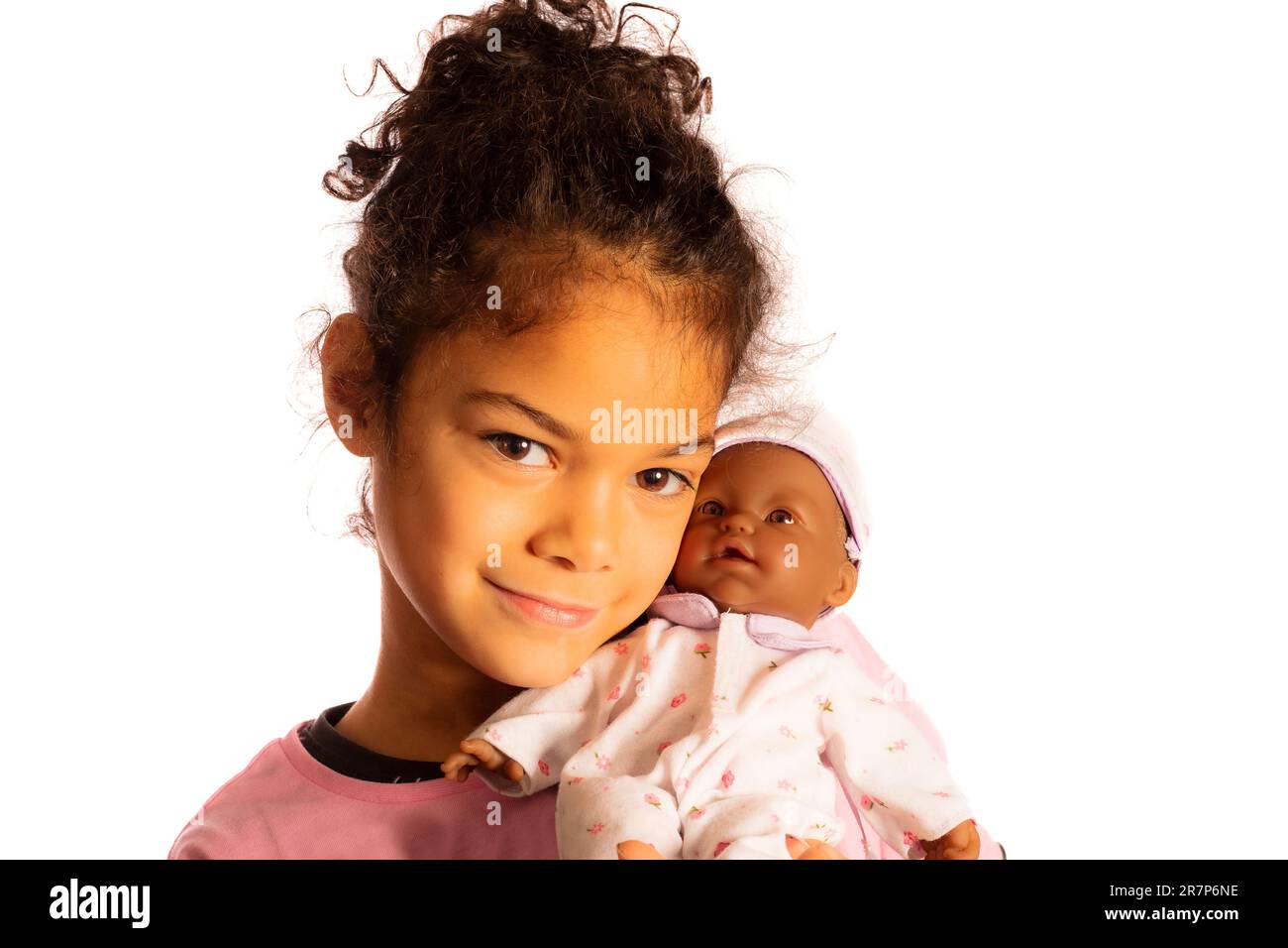 Young girl holding doll to face Stock Photo - Alamy Young girl holding doll to face Stock Photo - Alamy