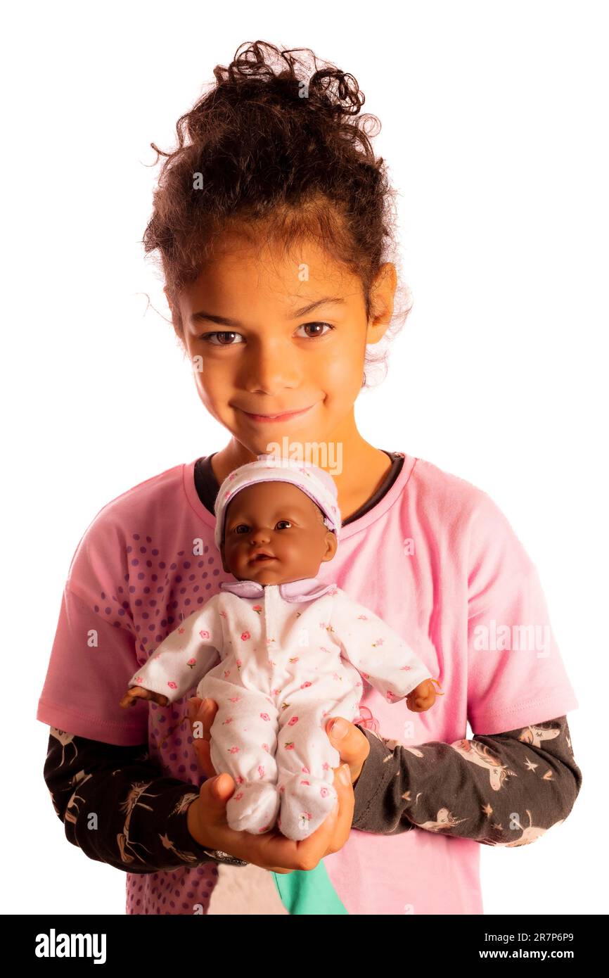Young girl holding doll Stock Photo - Alamy Young girl holding doll Stock Photo - Alamy