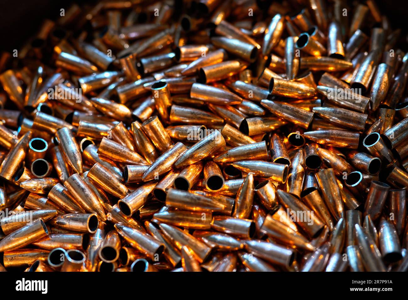 Large caliber copper shells pile for riffle as background Stock Photo ...