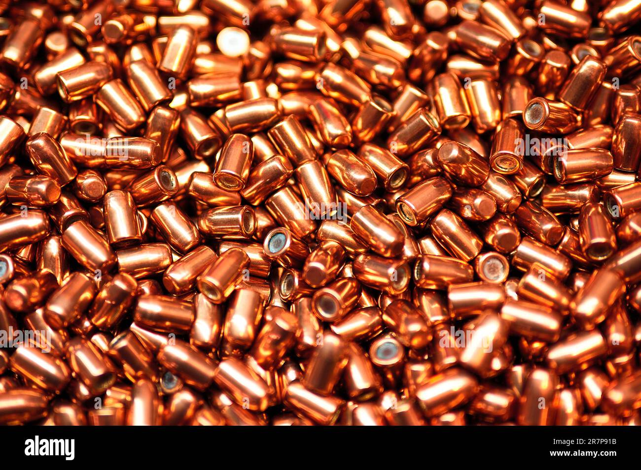 Sparkling golden bullets heap for firearms as background Stock Photo ...