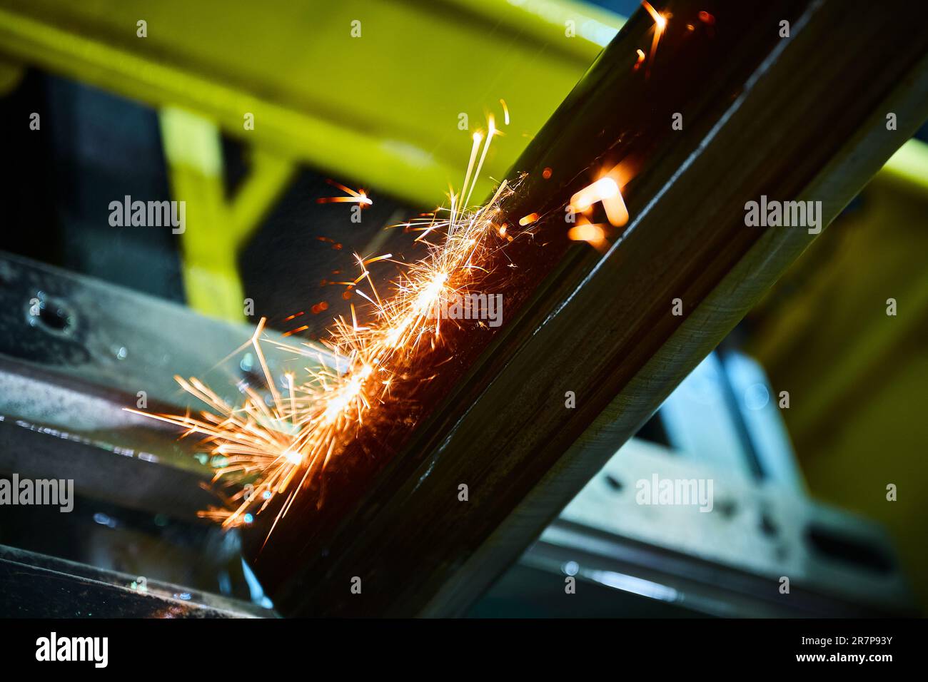 Electric erosion machining of metal beam with bright sparks Stock Photo ...