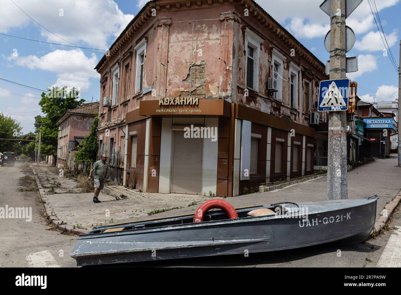 A boat seen in a former flooding area caused by the Kakhovka breach in ...
