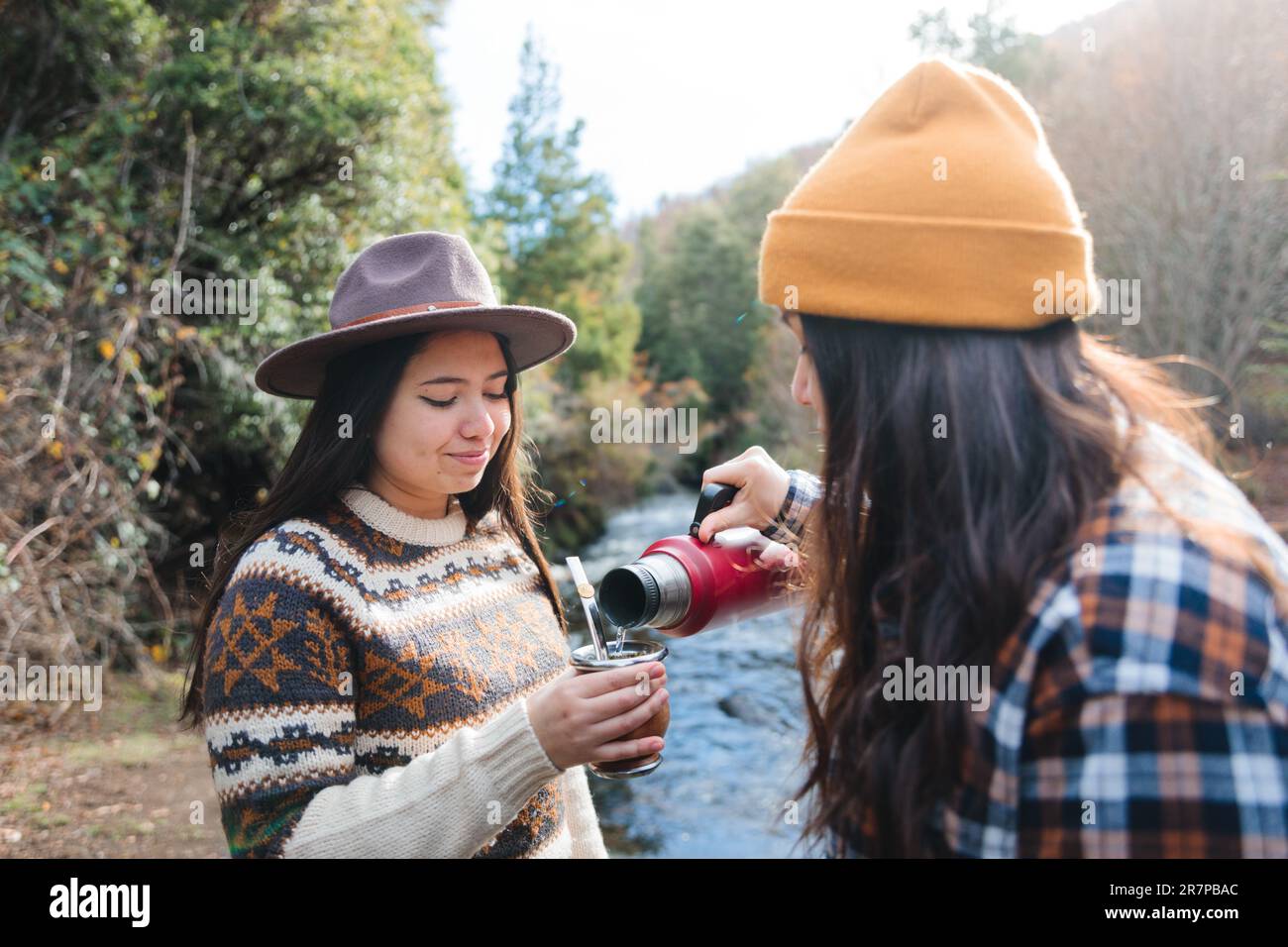 Autumn Bond: Two Young Women, in tranquil Nature scene, Brewing ...