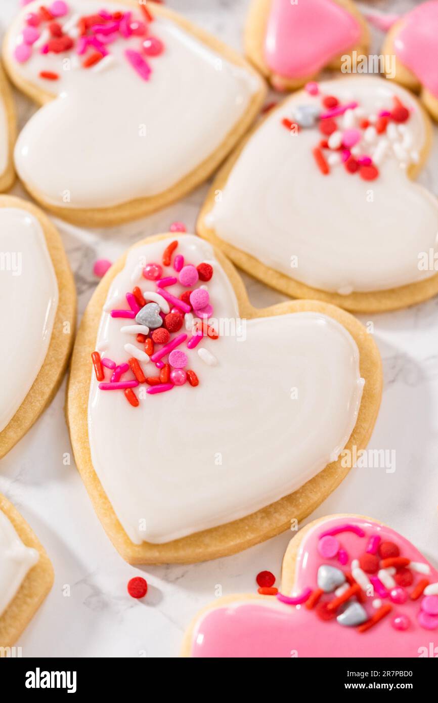 Heart-shaped sugar cookies with royal icing Stock Photo - Alamy