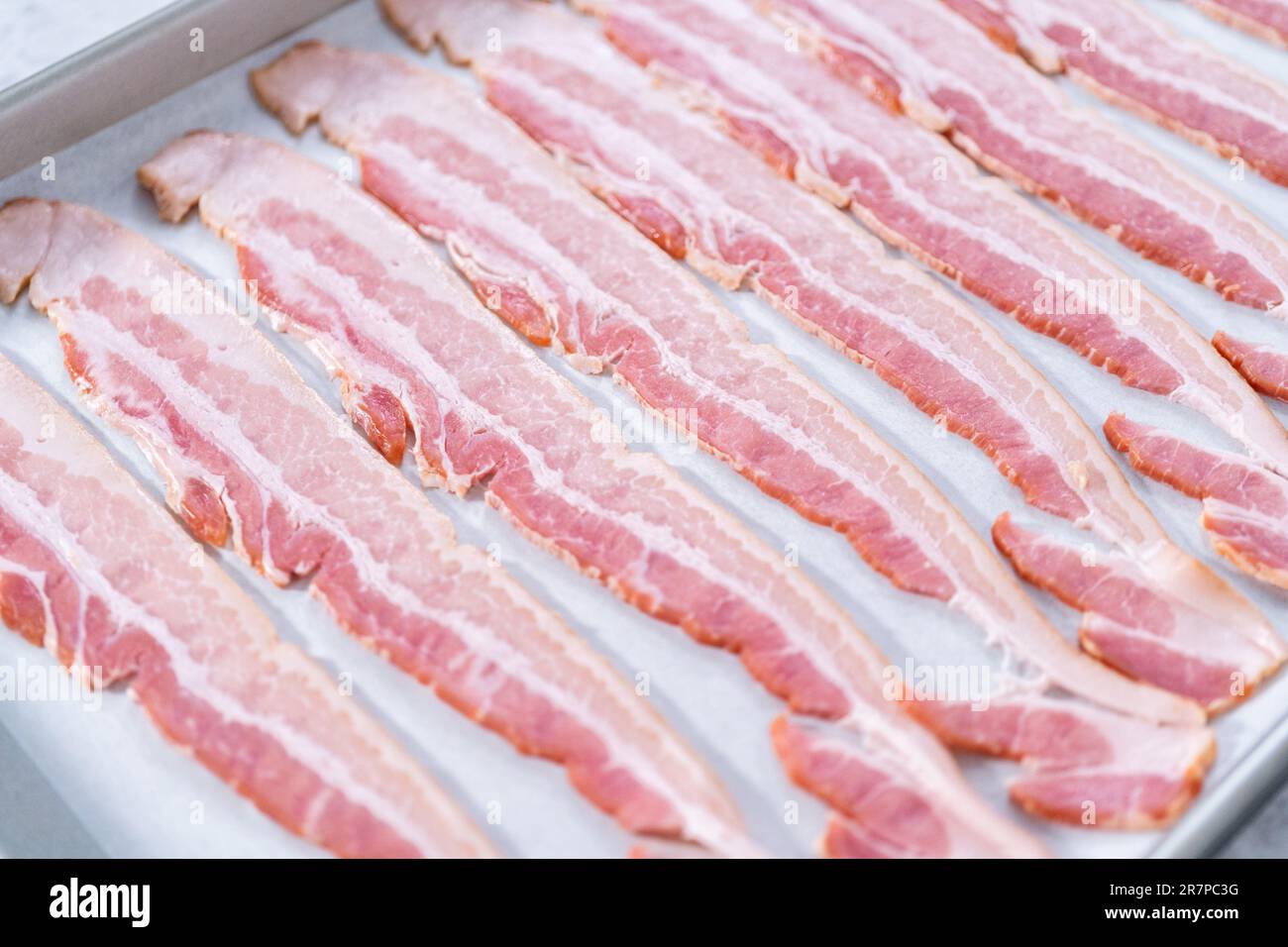 Cooking bacon strips Stock Photo - Alamy