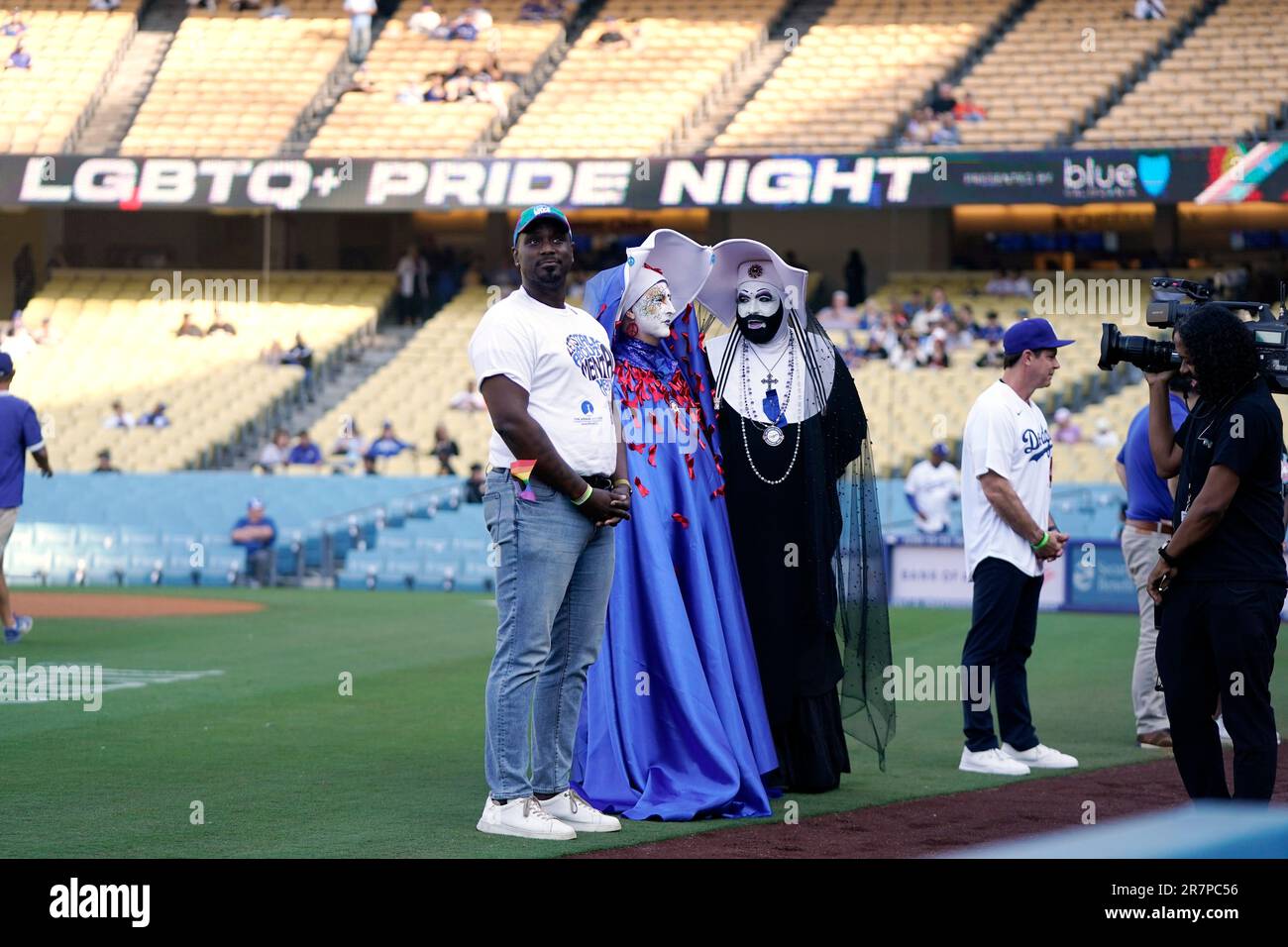 Gerald Garth, left, stands with members of the Sisters of Perpetual ...