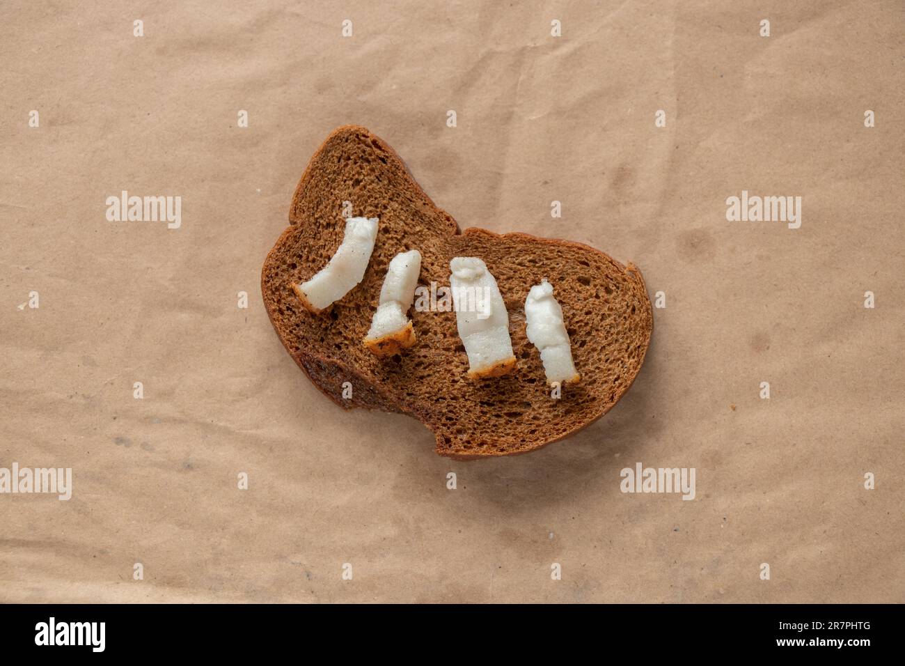 black slice of bread with lard on an isolated background, lunch Stock ...
