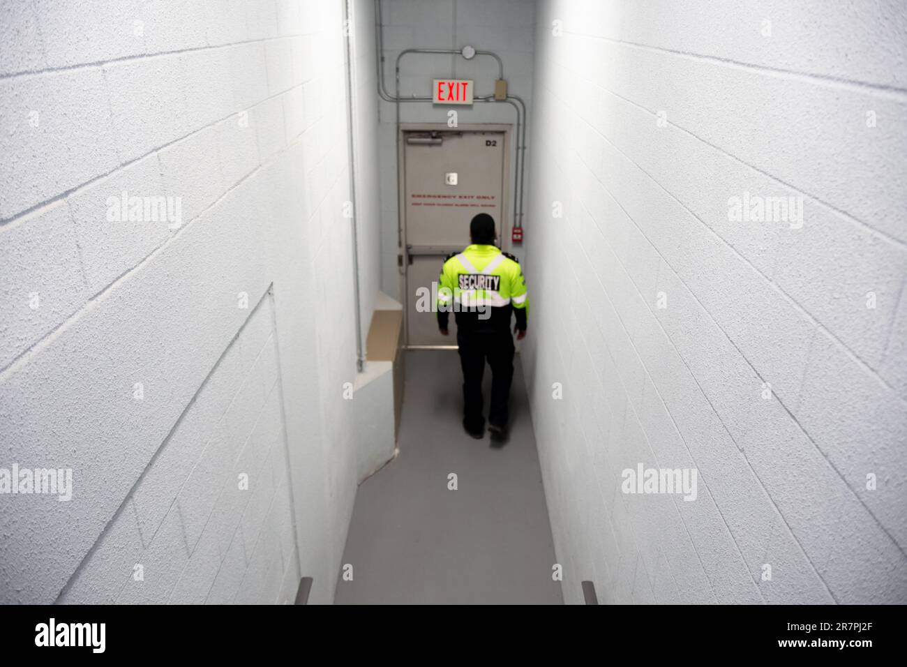 Security guard patrolling at night office Stock Photo - Alamy