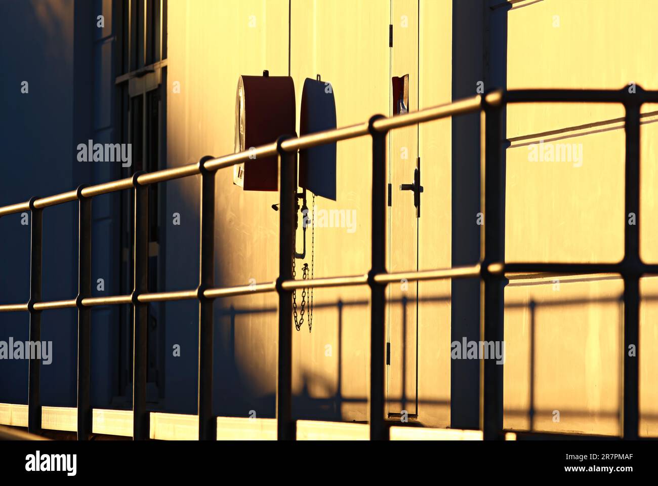 Random street photography of a side of a building with a railing at ...