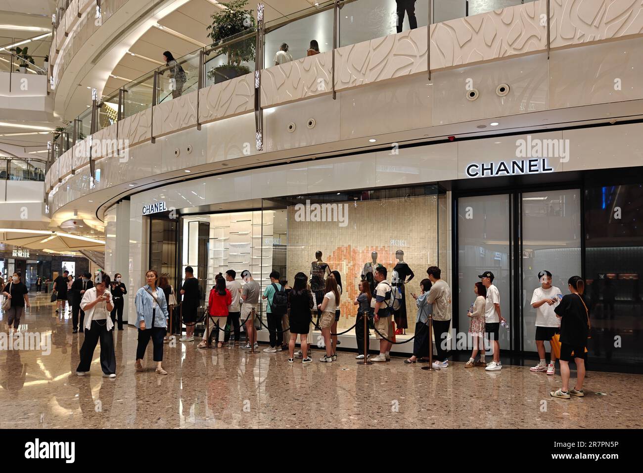 Customers line up at a luxury goods store in Shanghai, China, June 16 ...