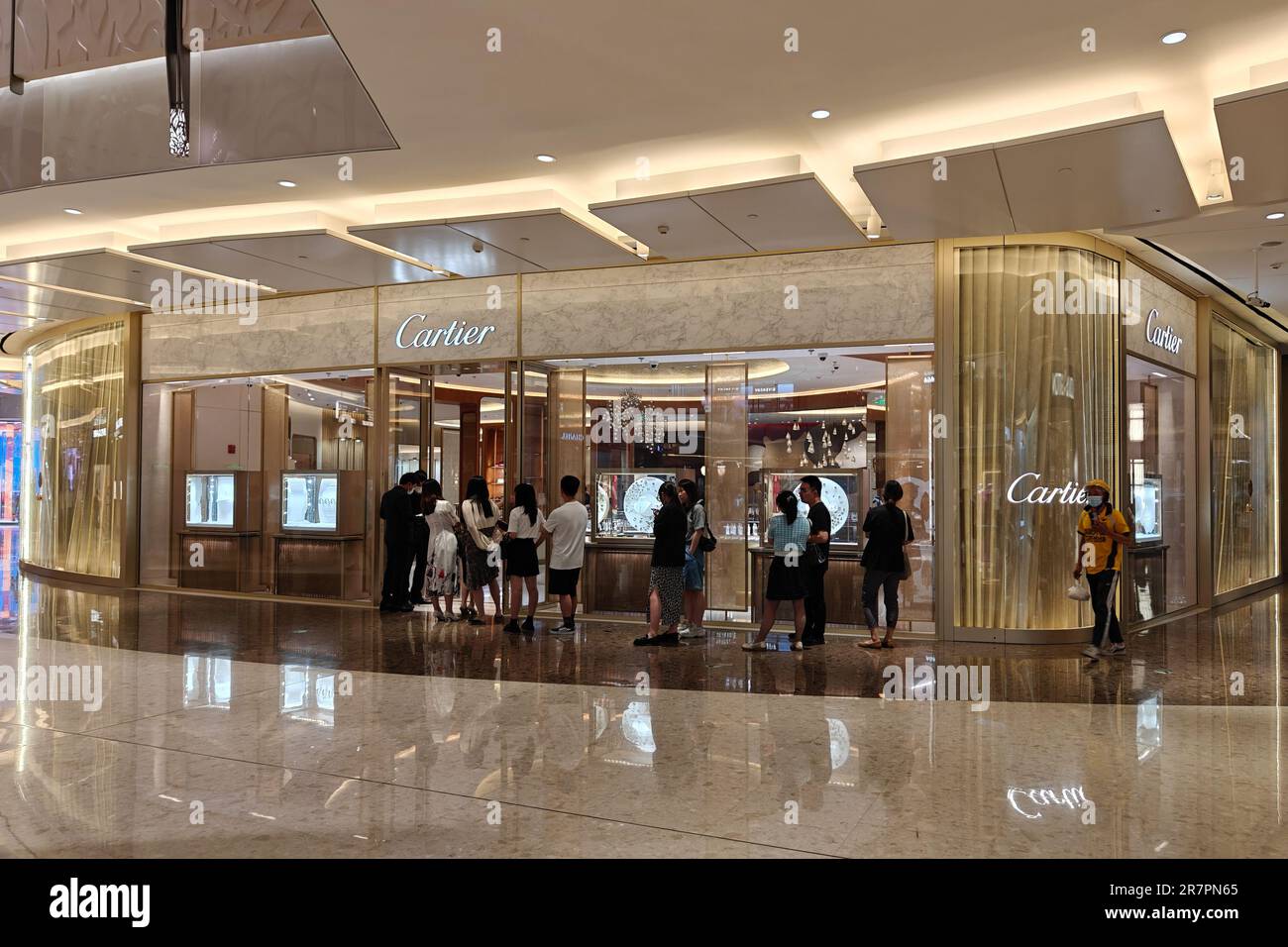 Customers line up at a luxury goods store in Shanghai, China, June 16 ...