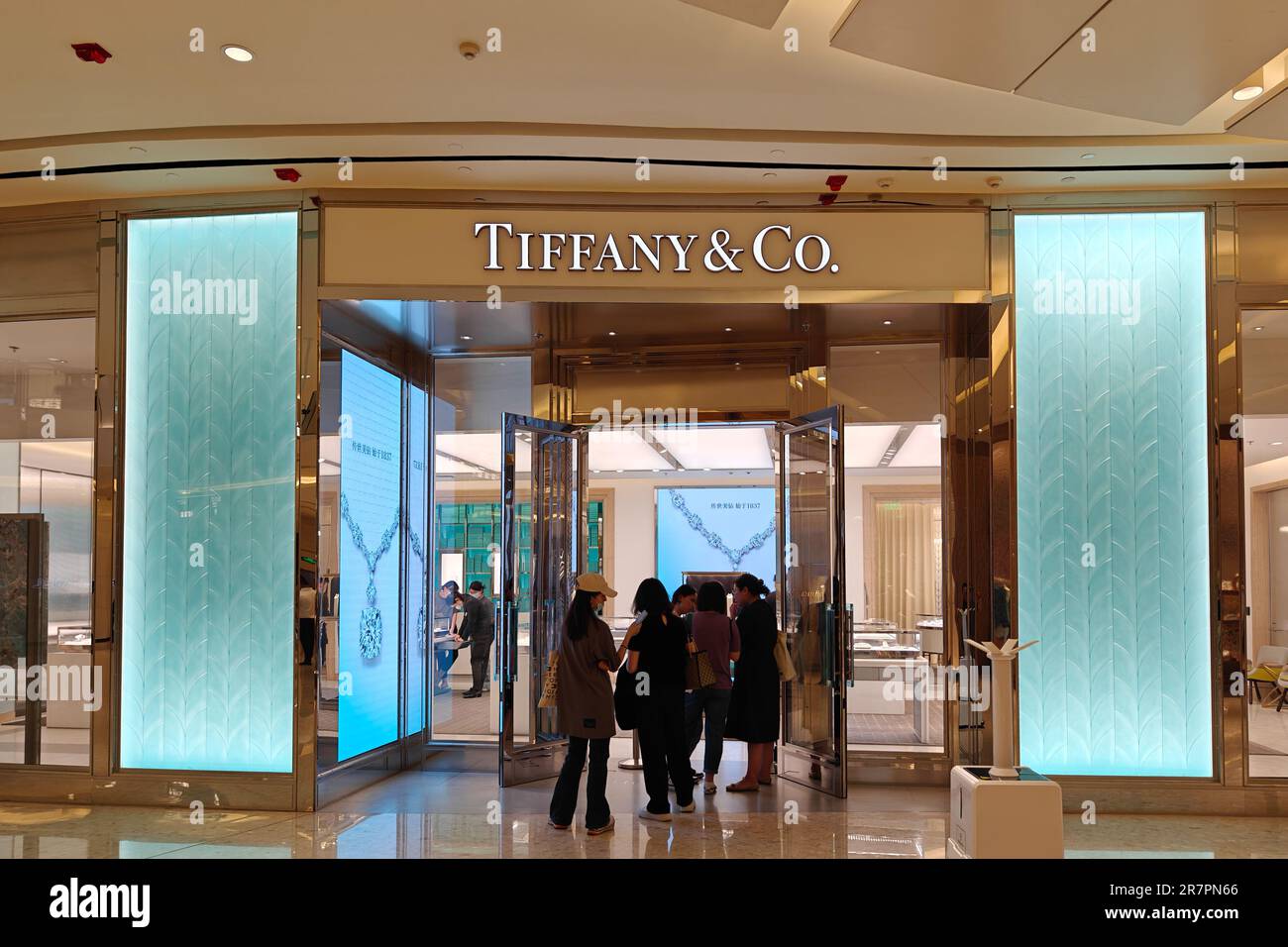 Customers line up at a luxury goods store in Shanghai, China, June 16 ...