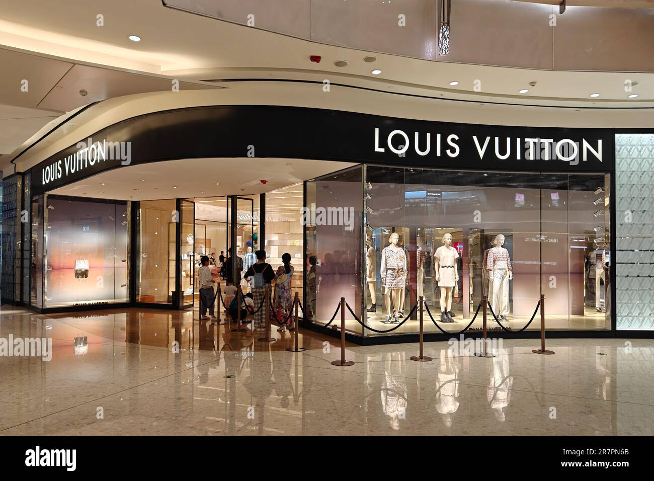 Customers line up at a luxury goods store in Shanghai, China, June 16 ...