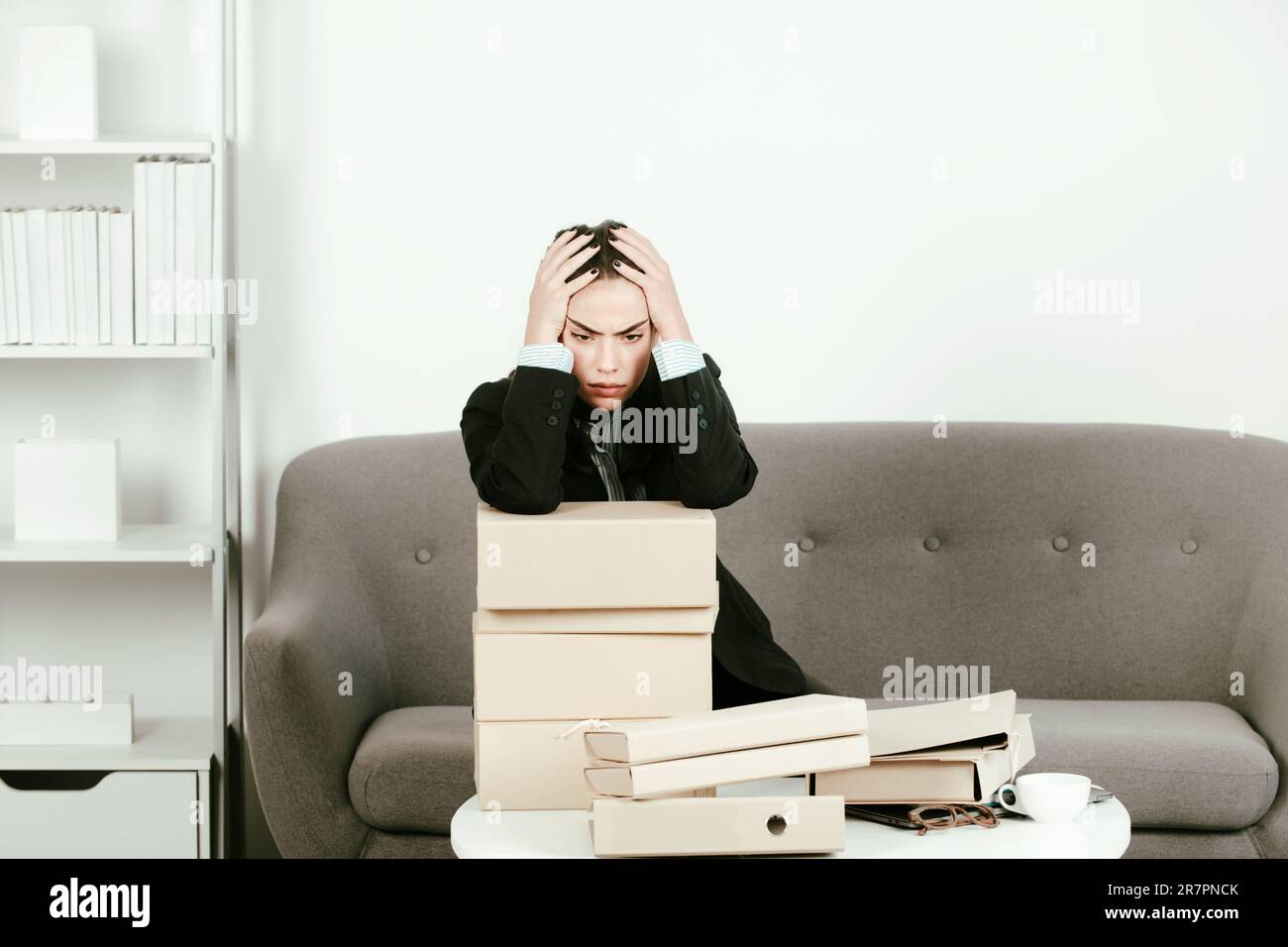 Sad secretary girl with folders with the documents , stressed ...