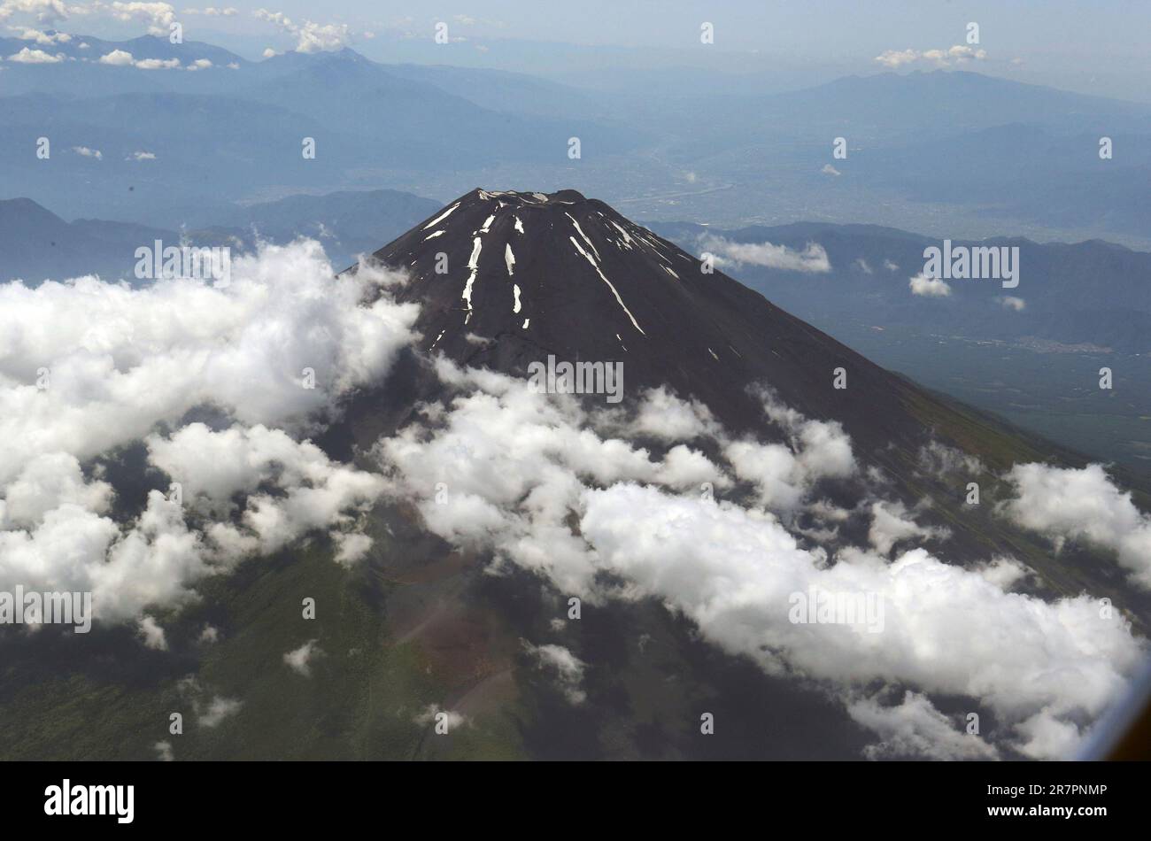 An aerial picture taken from a jetliner shows Mt. Fuji, the Japanese ...