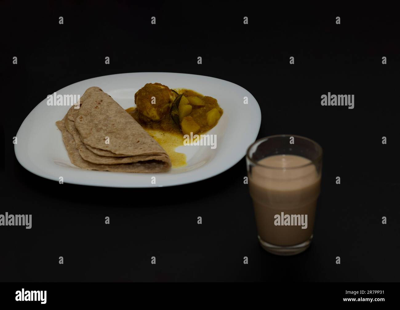 Closeup Image Of Indian Breakfast. Chapati, Egg Roast And Tea Stock ...