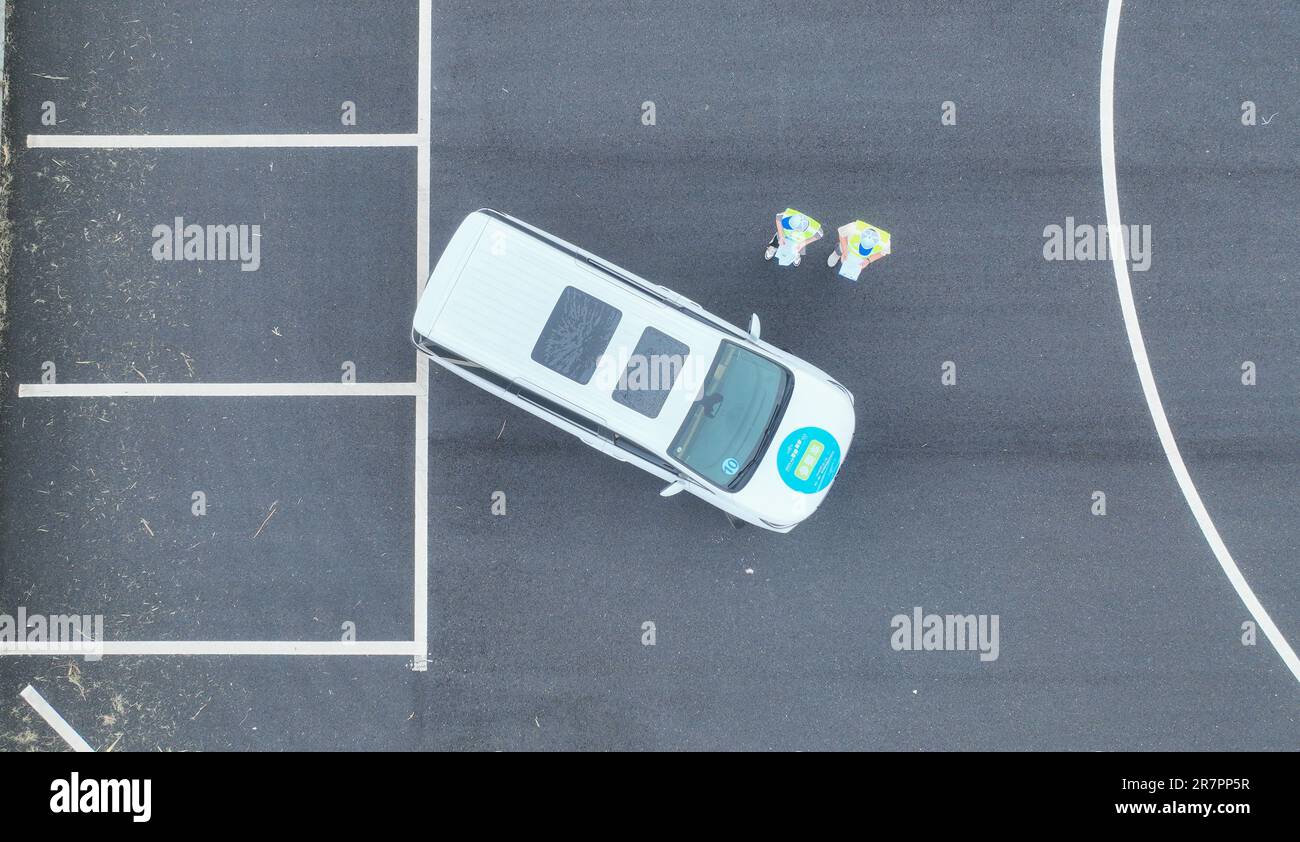 Vehicles take part in an automatic parking test at the Deqing ...