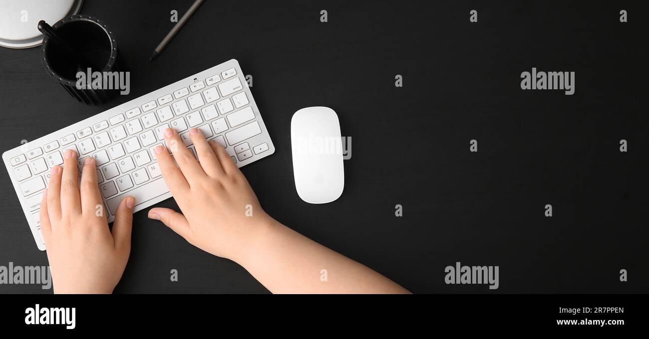 Hands of female programmer using PC keyboard at dark table, top view ...