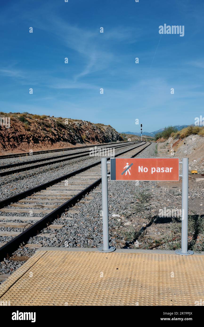large red sign on an old train station indicating "No Trespassing" In ...