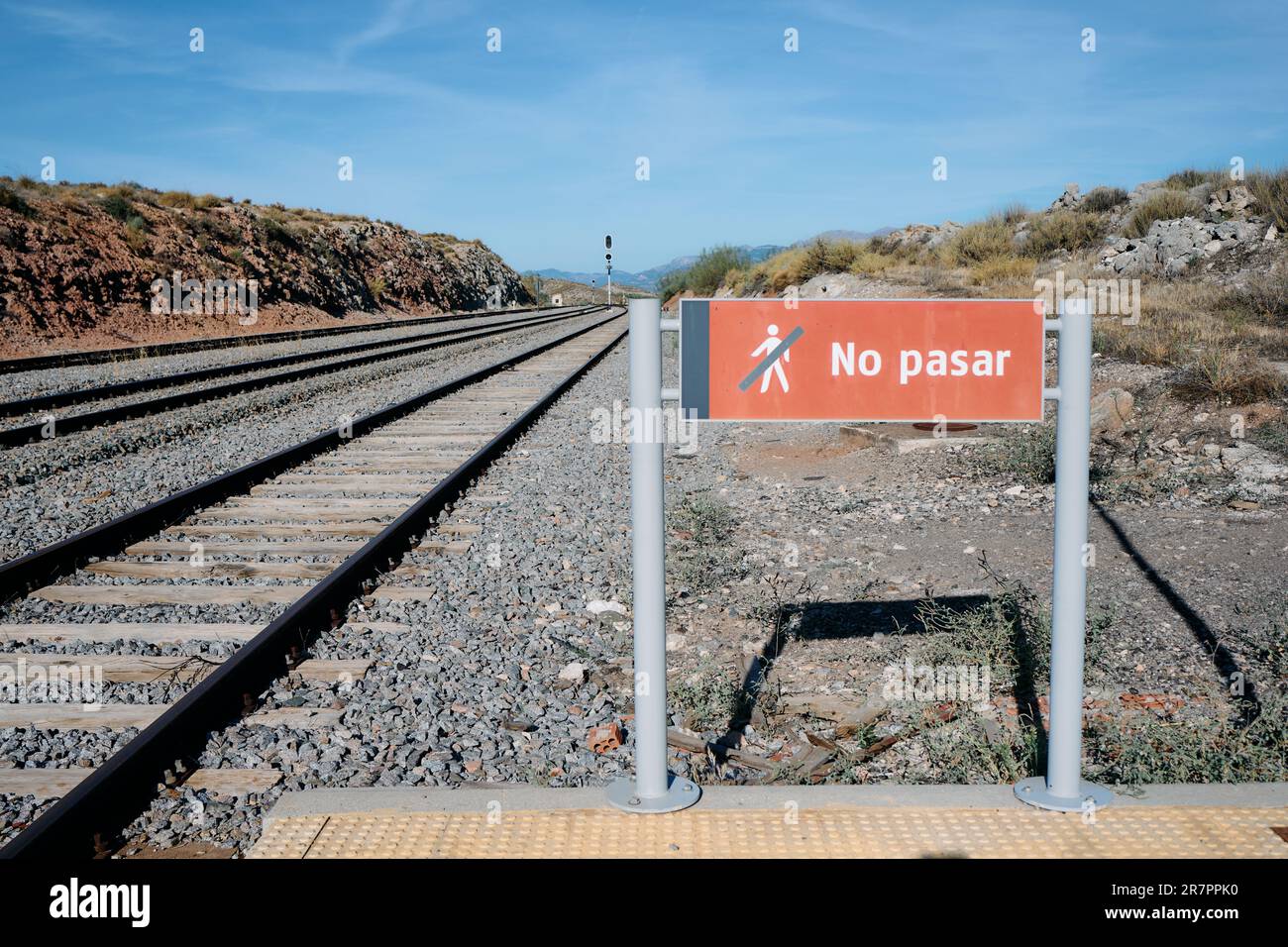 large red sign on an old train station indicating "No Trespassing" In ...