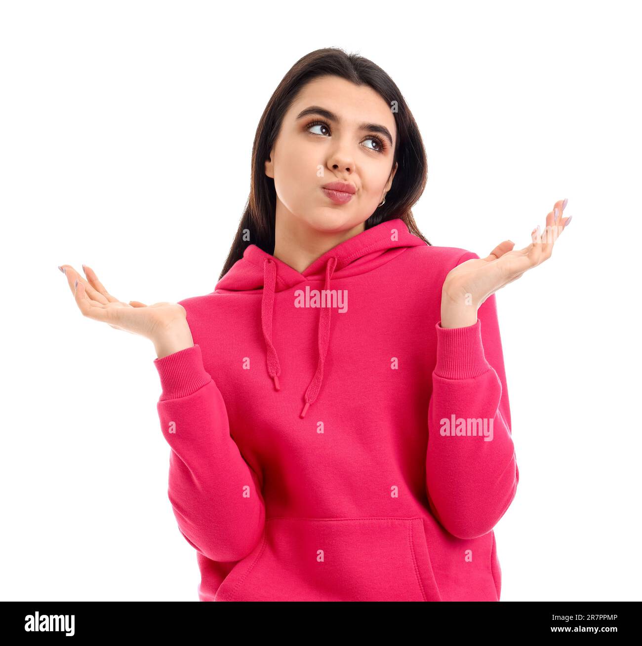 Confused young woman on white background Stock Photo - Alamy