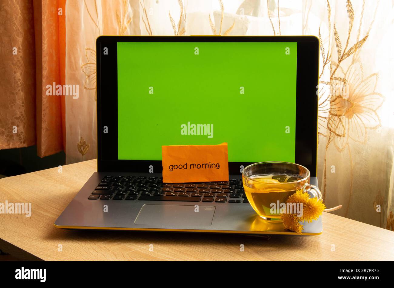 English word laptop good morning and cup of tea at home Stock Photo - Alamy