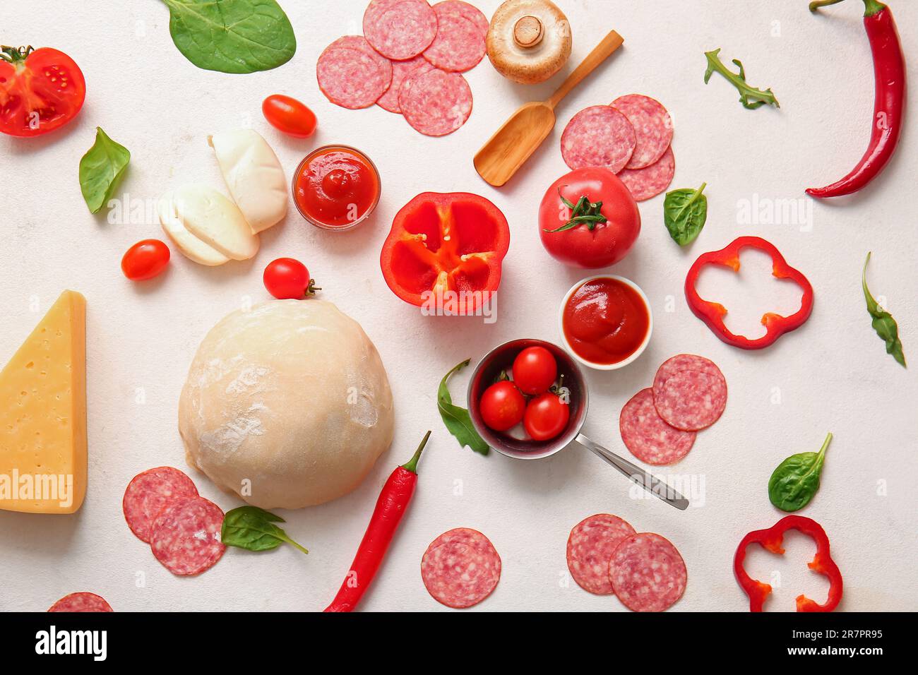 Different ingredients for preparing pizza on light background Stock ...