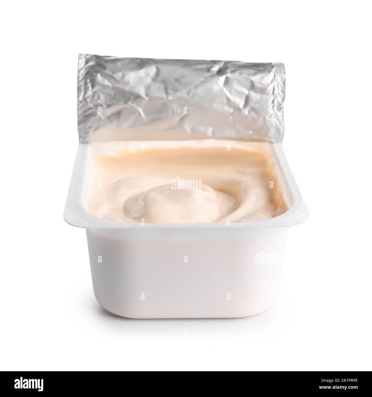 Plastic container with tasty cream cheese on white background Stock ...
