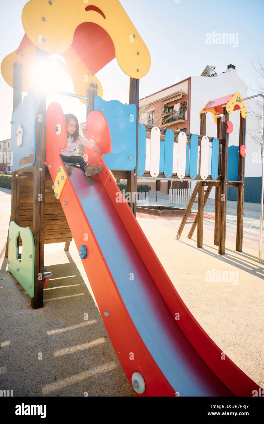 Happy Little Girl Sliding Fotolia