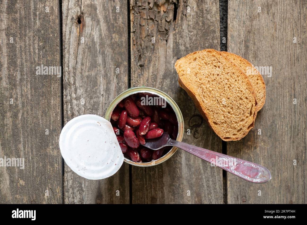 red beans in an iron jar on the table in the kitchen for lunch next to ...