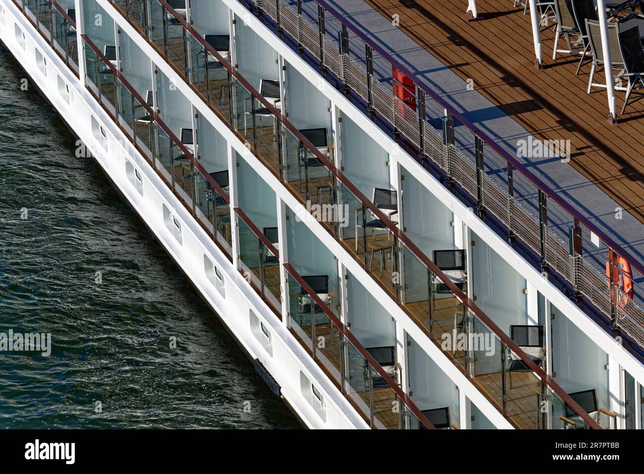 Cologne, Germany. 17th June, 2023. Chairs stand in the loggias in front of the cabins of a ...