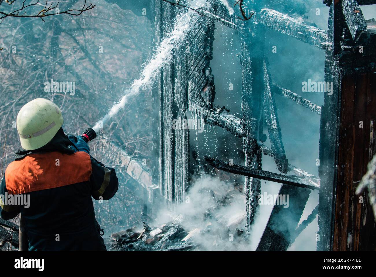 Real brave hero combat the fire with foam extinguisher. Strong and ...