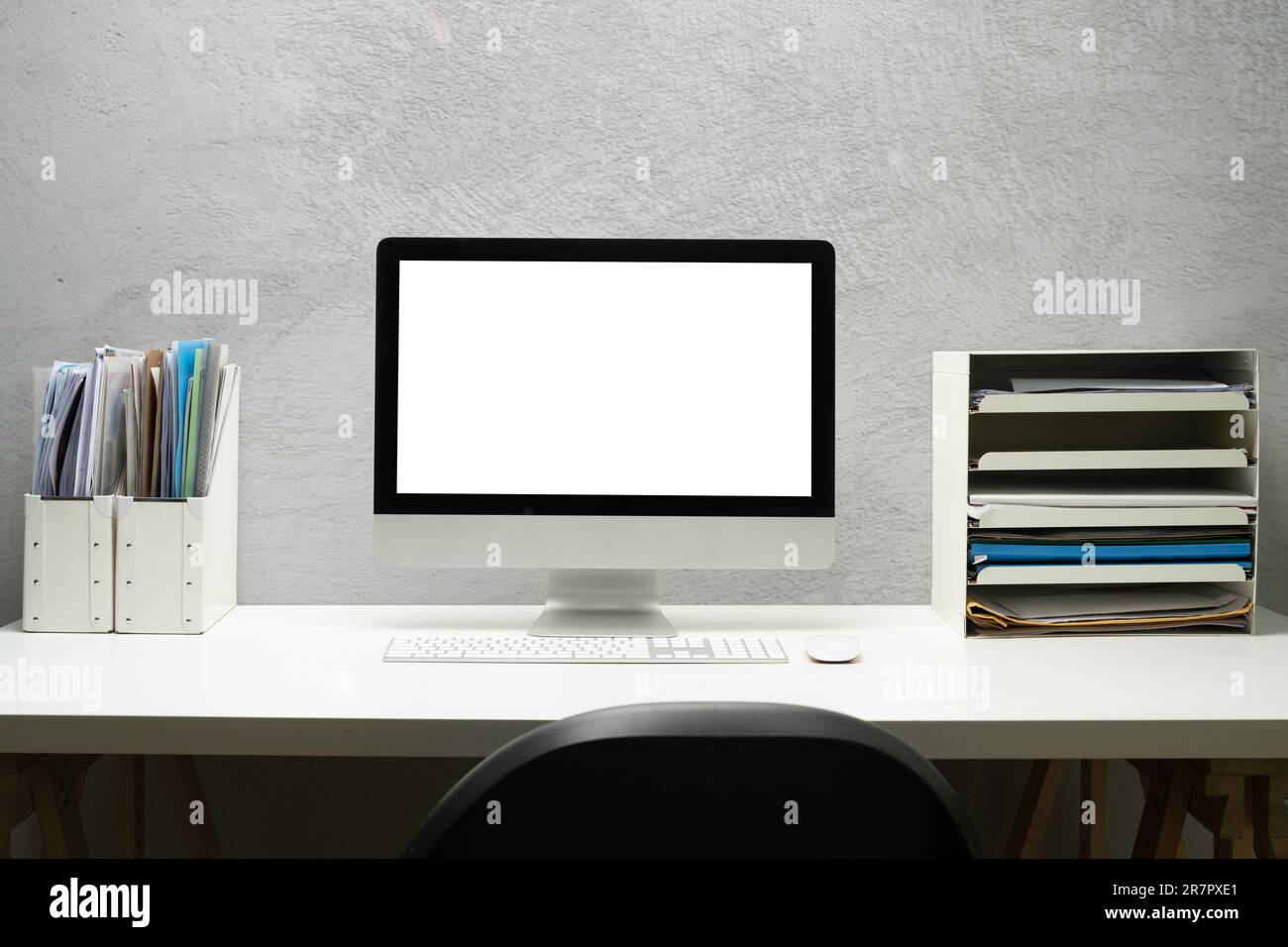 Blank screen computer, lamp, pencil holder and potted plant on white ...