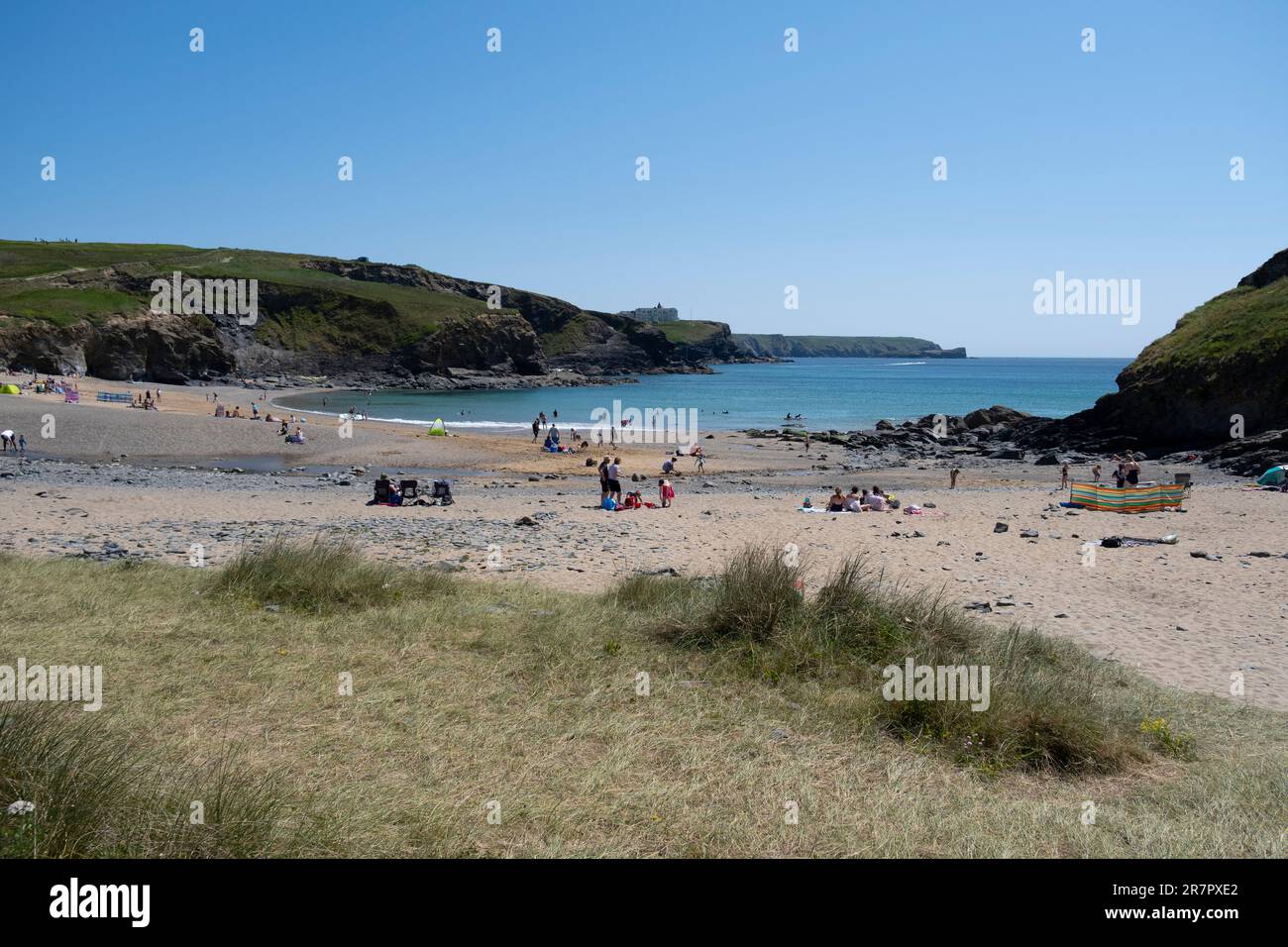Holiday makers on the beach at Gunwalloe and Dollar coves on the south ...
